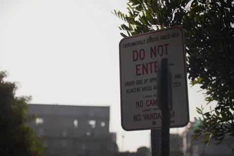 Do not enter sign, bushes, apartments in... | Stock Video | Pond5