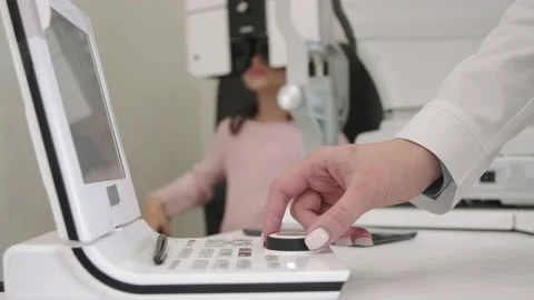 Doctor Adjusting Eye Chart Projector Dur... | Stock Video | Pond5