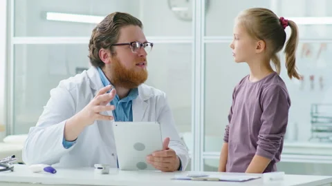 Doctor and Little Girl Using Tablet in M... | Stock Video | Pond5