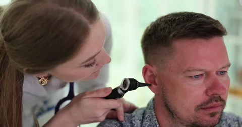 Doctor-assistant uses otoscope for inner... | Stock Video | Pond5
