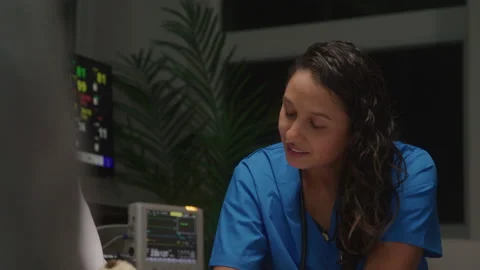 Doctor in Blue Scrubs and Long Brown Hai... | Stock Video | Pond5