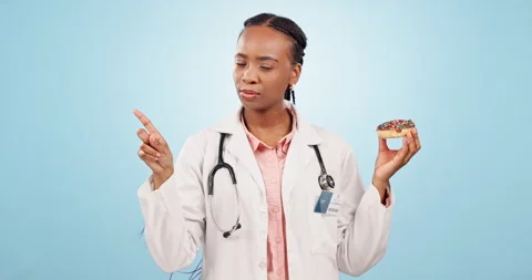 Doctor, donut and face of black woman wi... | Stock Video | Pond5