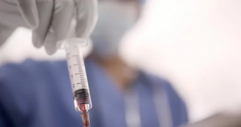Doctor Drawing Blood Into Syringe in lab... | Stock Video | Pond5