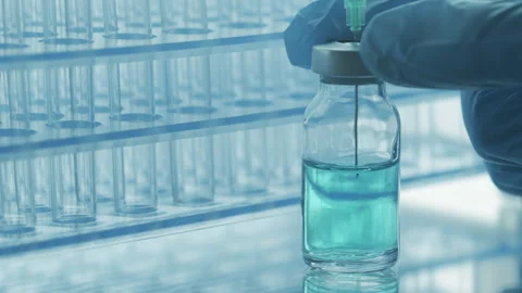 A doctor is drawing up vaccine from phia... | Stock Video | Pond5