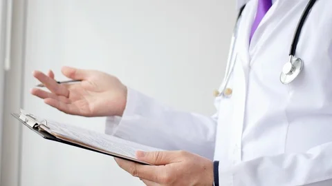A doctor explaining something by making ... | Stock Video | Pond5