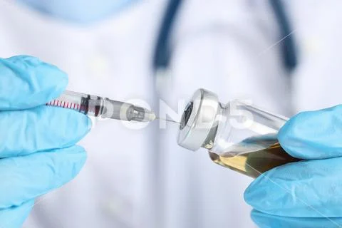 Doctor inserting syringe into glass vial with medication, closeup ~ Hi ...