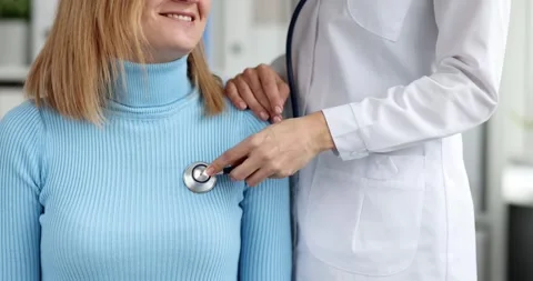 Doctor listens to heartbeat of woman pat... | Stock Video | Pond5