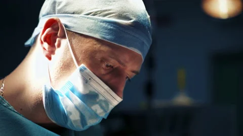 Doctor in medical cap and mask. Portrait... | Stock Video | Pond5