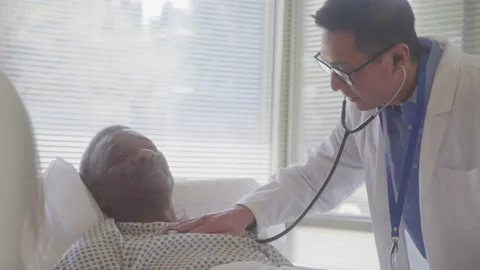 Doctor Monitoring Patients Heart Rate | Stock Video | Pond5