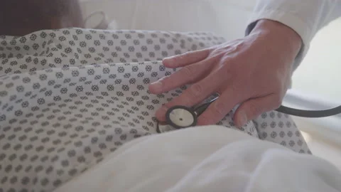 Doctor Monitoring A Patients Heart Rate | Stock Video | Pond5