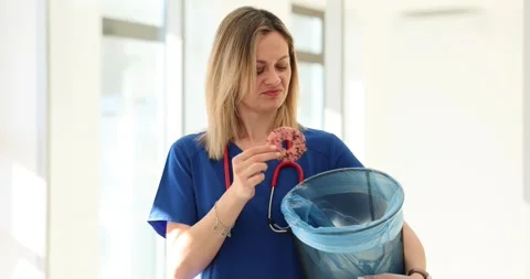 Doctor nutritionist throwing sweet donut... | Stock Video | Pond5