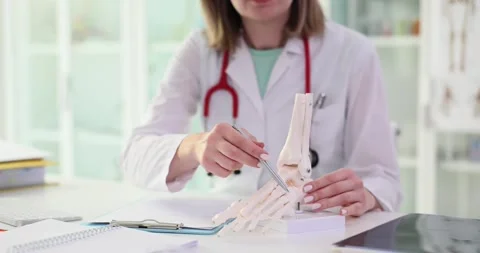 Doctor orthopedist shows model of struct... | Stock Video | Pond5