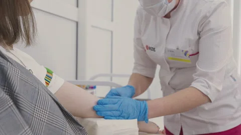 Doctor Prepares Patient Hand For Blood D... | Stock Video | Pond5