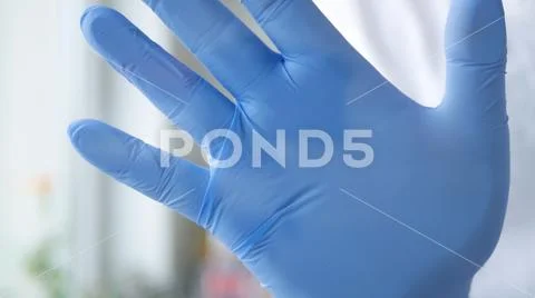 Doctor Put His Hand with Glove on the Window Making a Stop Hand ...