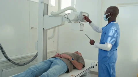 Doctor Setting X-ray Scanner For Patient | Stock Video | Pond5