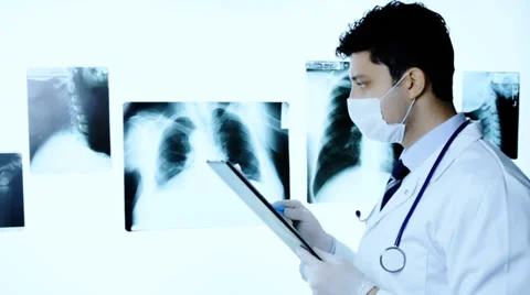 Doctor Taking Notes X ray Scans Dark Roo... | Stock Video | Pond5
