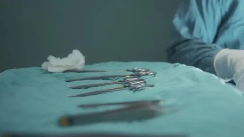 A doctor using surgical tools during the... | Stock Video | Pond5