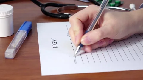 Doctor writing a receipt for patient, si... | Stock Video | Pond5
