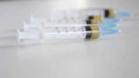 Doctor's hand lean one medical syringe w... | Stock Video | Pond5