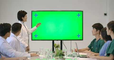Doctors making presentation with green s... | Stock Video | Pond5