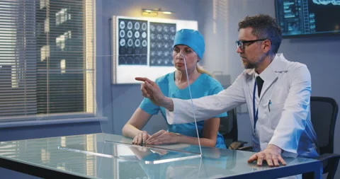 Doctors using transparent display screen | Stock Video | Pond5