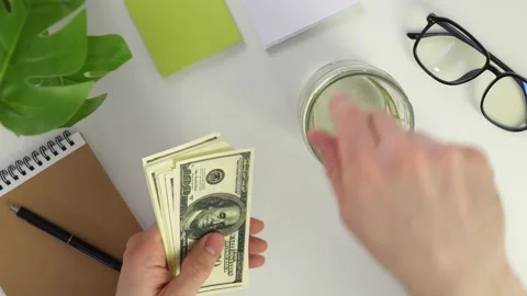 Dollars on a white background. Count mon... | Stock Video | Pond5