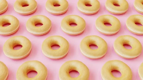 Dolly pan Zoom Doughnuts on color pink b... | Stock Video | Pond5