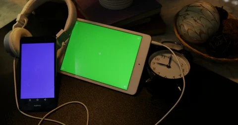 Dolly shoot of blue screen cellphone and... | Stock Video | Pond5