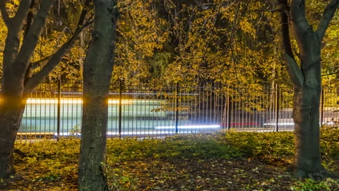 dolly shot of the movement of cars along... | Stock Video | Pond5