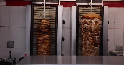 Doner kebab meat spinning on rotisserie ... | Stock Video | Pond5