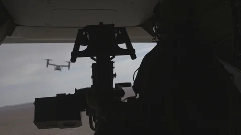 Door gunner rotating machine gun on MV-2... | Stock Video | Pond5