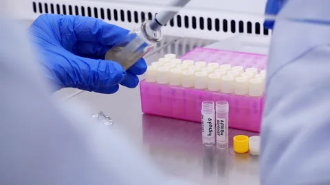 Dosing liquid in test tubes in the labor... | Stock Video | Pond5