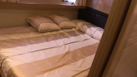 Double bed in cabin on luxury yacht | Stock Video | Pond5
