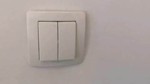 Double white electric light switch on wh... | Stock Video | Pond5