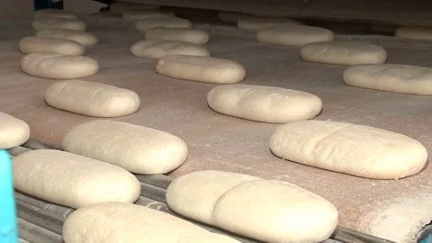 The dough in the form of bread moving al... | Stock Video | Pond5