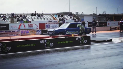 A drag race car starts racing | Stock Video | Pond5