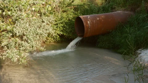 drain pipe. Water flows from a large met... | Stock Video | Pond5