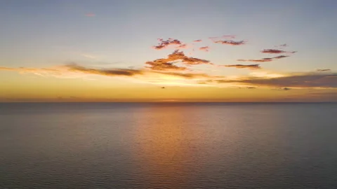 Dramatic bright red sky at ocean sunset,... | Stock Video | Pond5