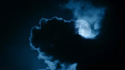 Dramatic Moon Comes Out From Behind Dark... | Stock Video | Pond5