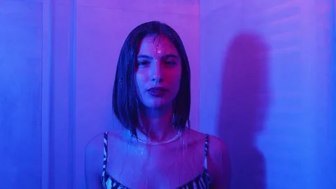 Dramatic scene: girl showering dressed, ... | Stock Video | Pond5