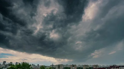 Dramatic storm sky clouds moving over ci... | Stock Video | Pond5