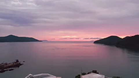 Dramatic sunset. Aerial flying backwards... | Stock Video | Pond5