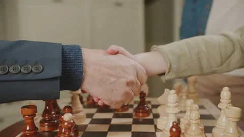 Draw in chess game. Players shake hands ... | Stock Video | Pond5