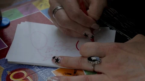 Drawing art board games. Playing Piction... | Stock Video | Pond5
