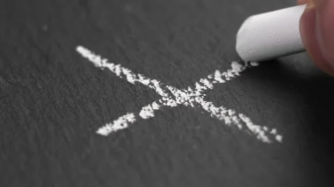 Drawing a cross sign with white chalk on... | Stock Video | Pond5