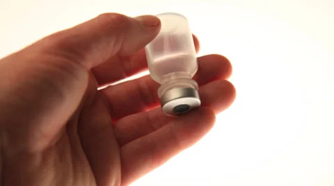 Drawing a medication from a vial with a ... | Stock Video | Pond5