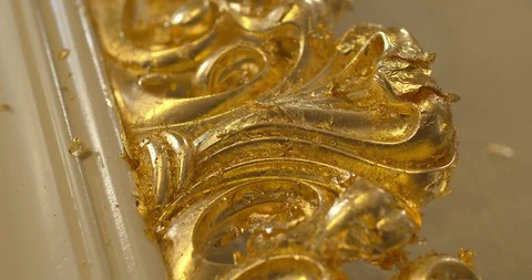 Drawing a patina, golden color, on a bea... | Stock Video | Pond5