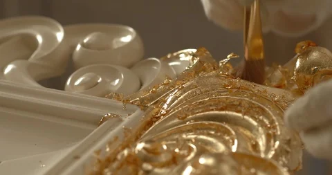 Drawing a patina, golden color, on a bea... | Stock Video | Pond5