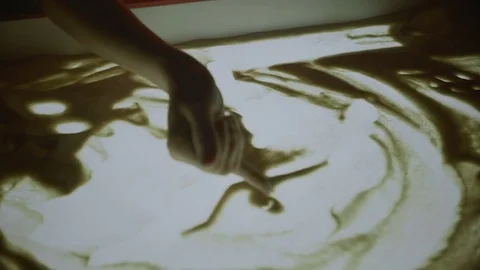 Drawing with sand. Short show. Drawing s... | Stock Video | Pond5
