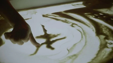 Drawing with sand. Short show. Drawing s... | Stock Video | Pond5